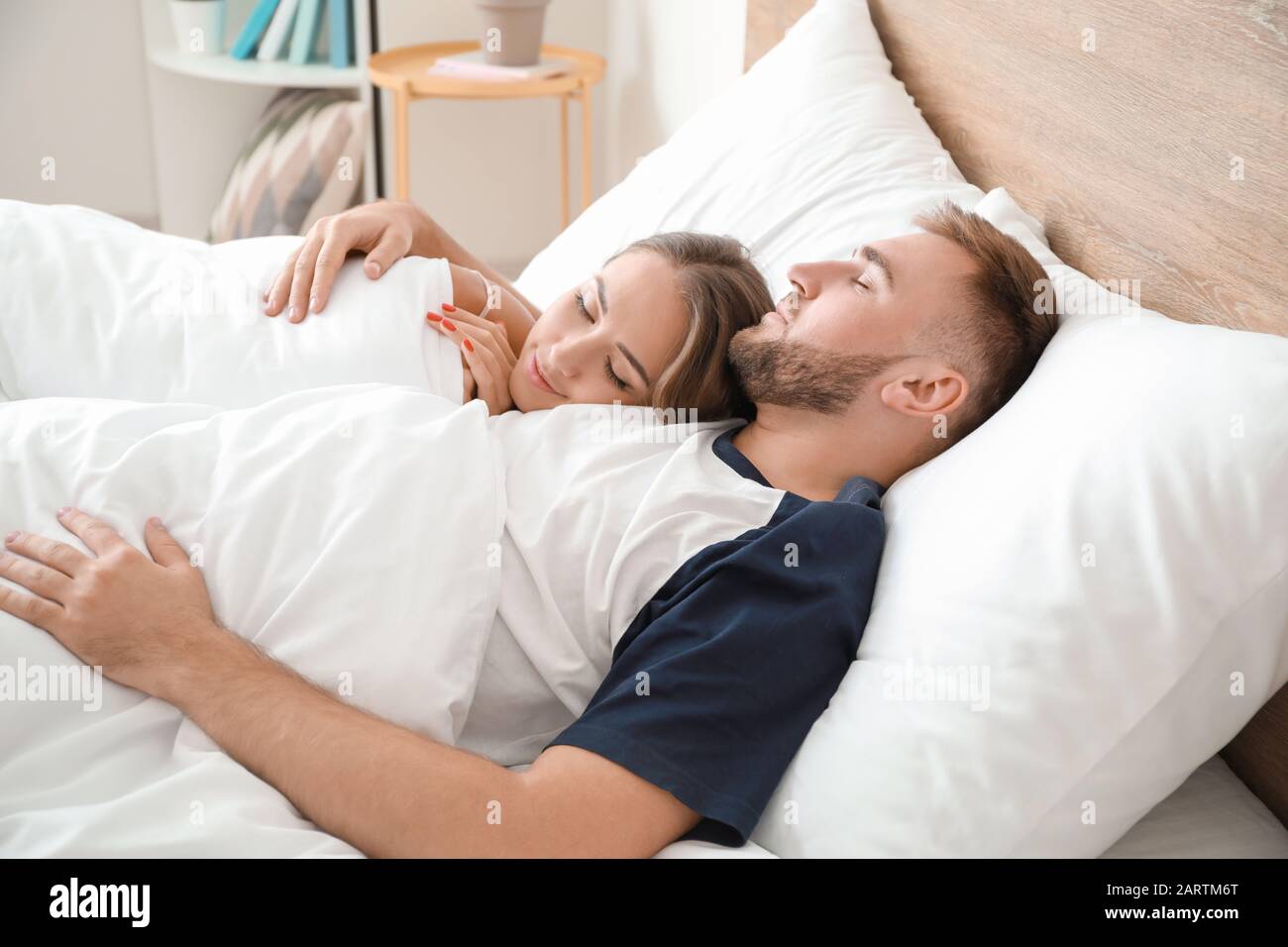 Morning of young couple sleeping in bed Stock Photo - Alamy