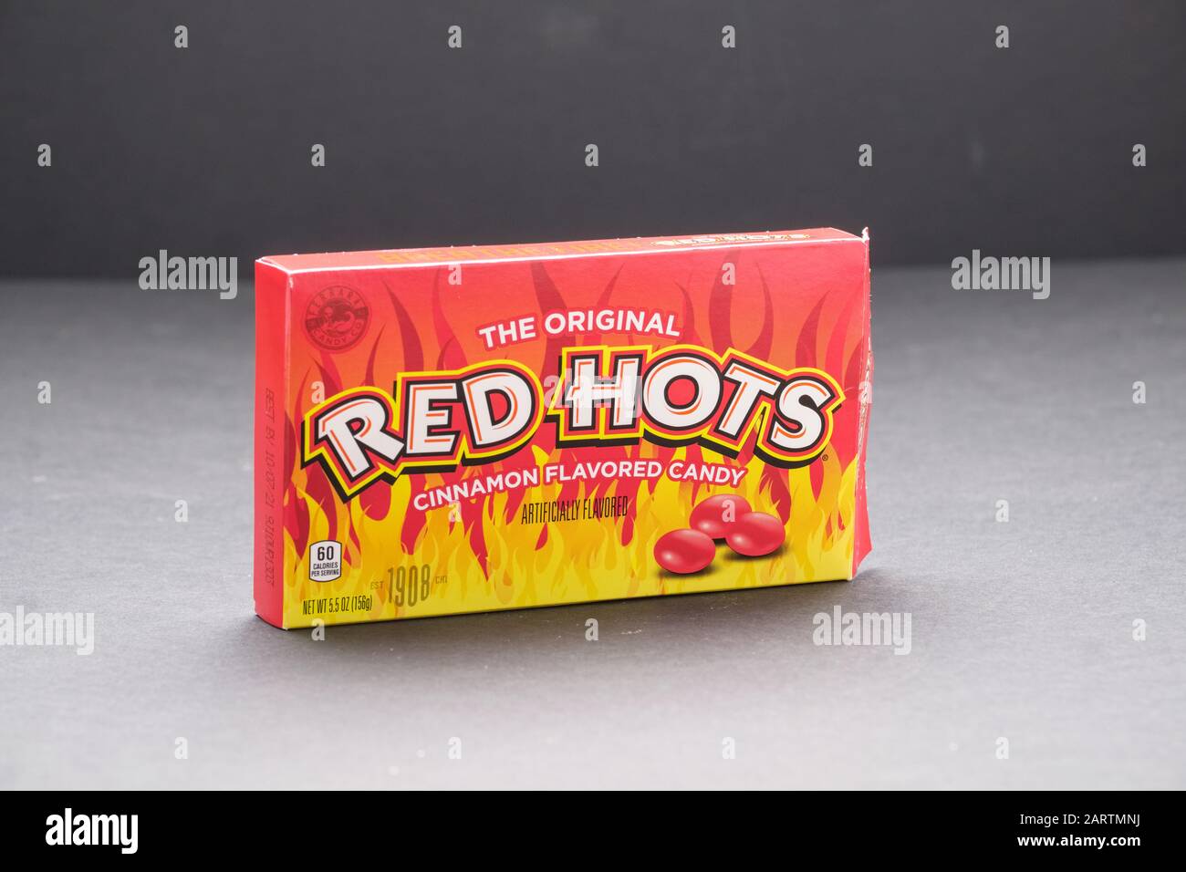 Box of cinnamon flavored spicy candy on dark background Stock Photo - Alamy