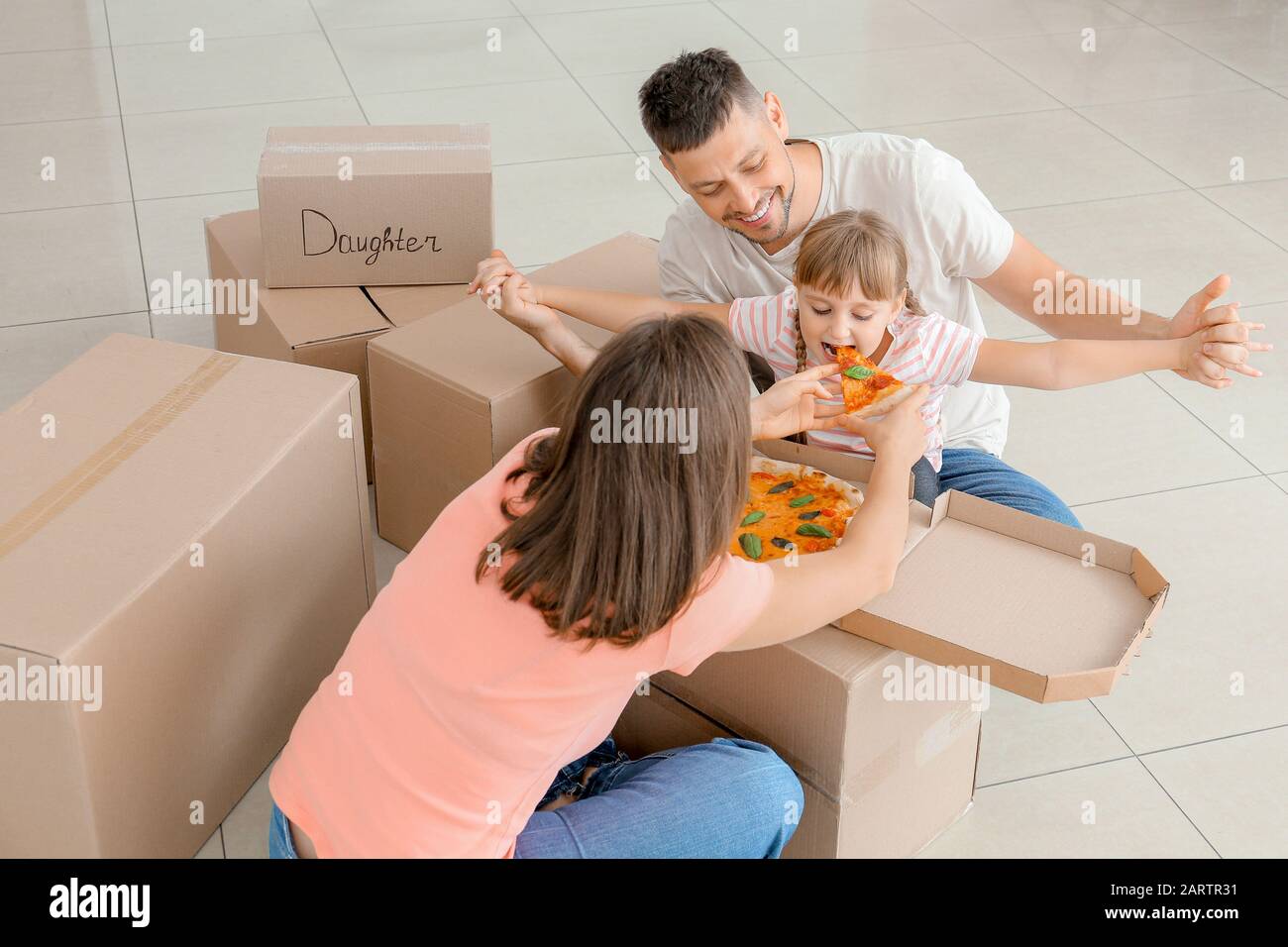 Woman feeding husband pizza hi-res stock photography and images - Alamy