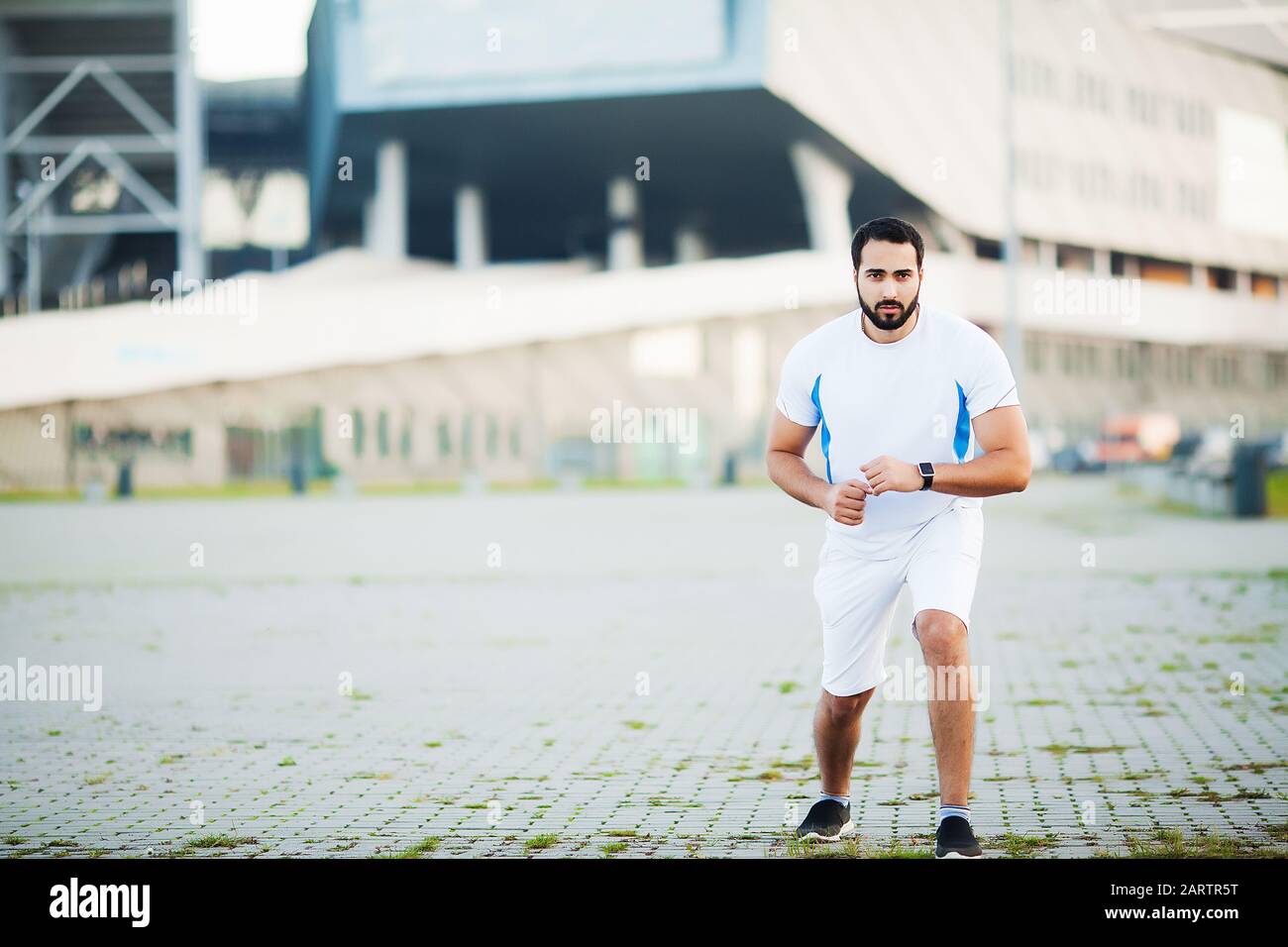 Fit muscular man running outside. Fitness and sport concept Stock Photo ...