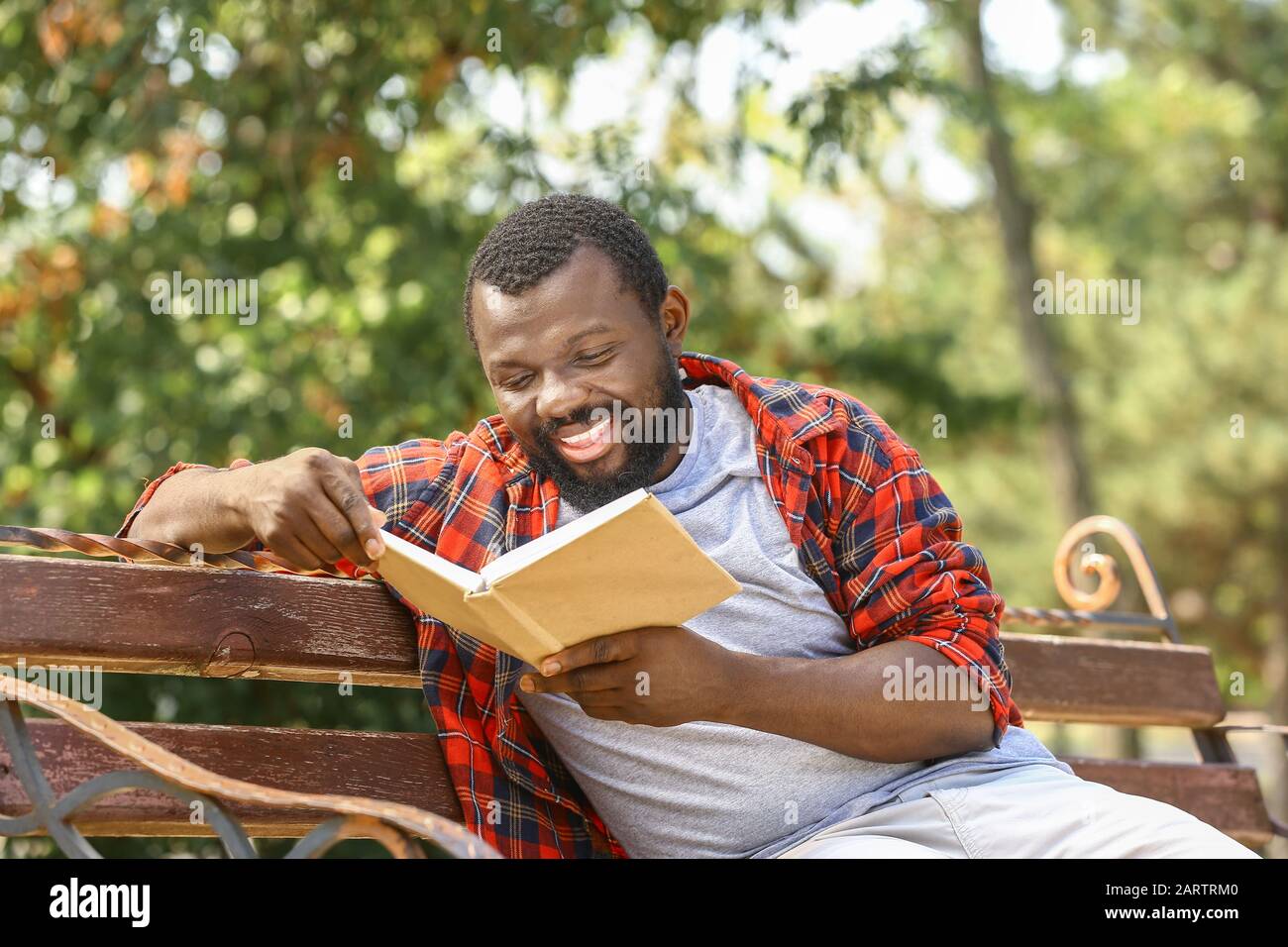 African american man reading book hi-res stock photography and images ...