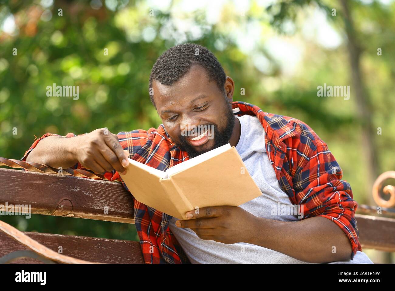 African american man reading book hi-res stock photography and images ...