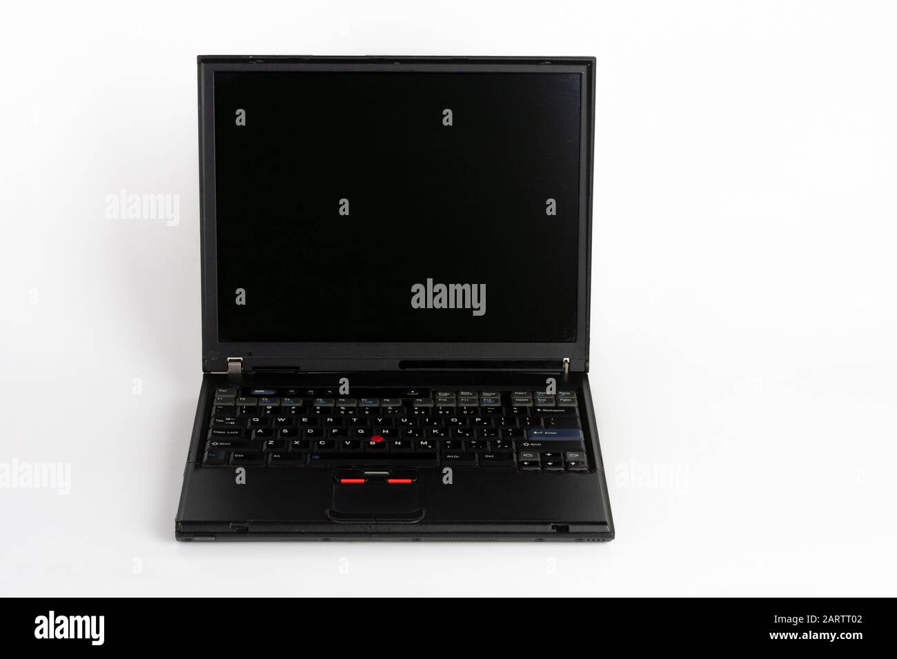 Old laptop on white background, which was produced in 2003, diagonal ...
