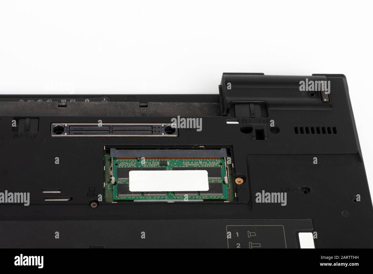 Close up of laptop memory module on slot of motherboard. Underside of ...