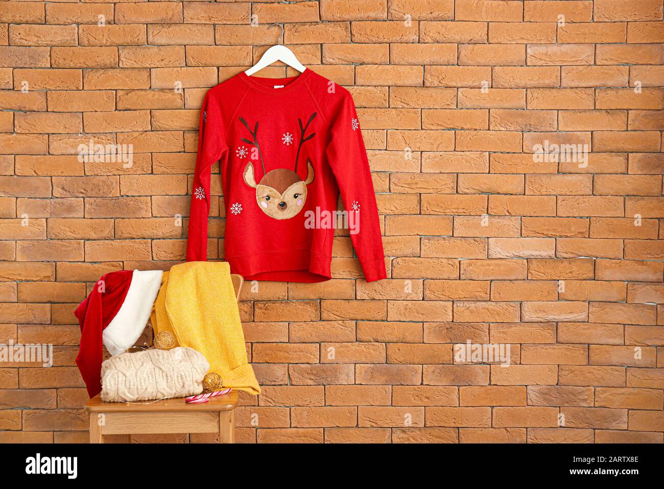 Winter clothes with chair and Santa Claus hat in dressing room Stock ...