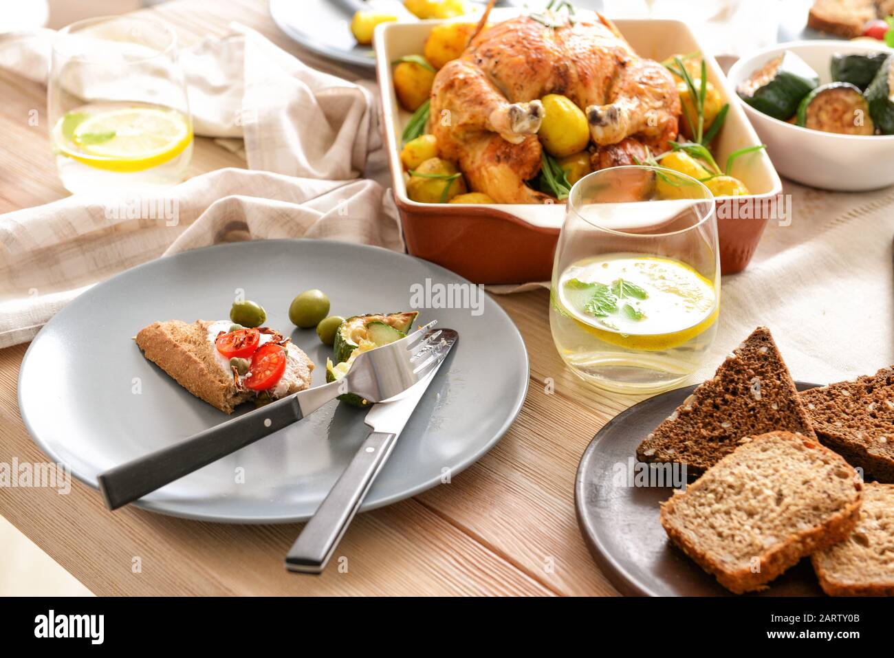 Table set for big family dinner Stock Photo - Alamy