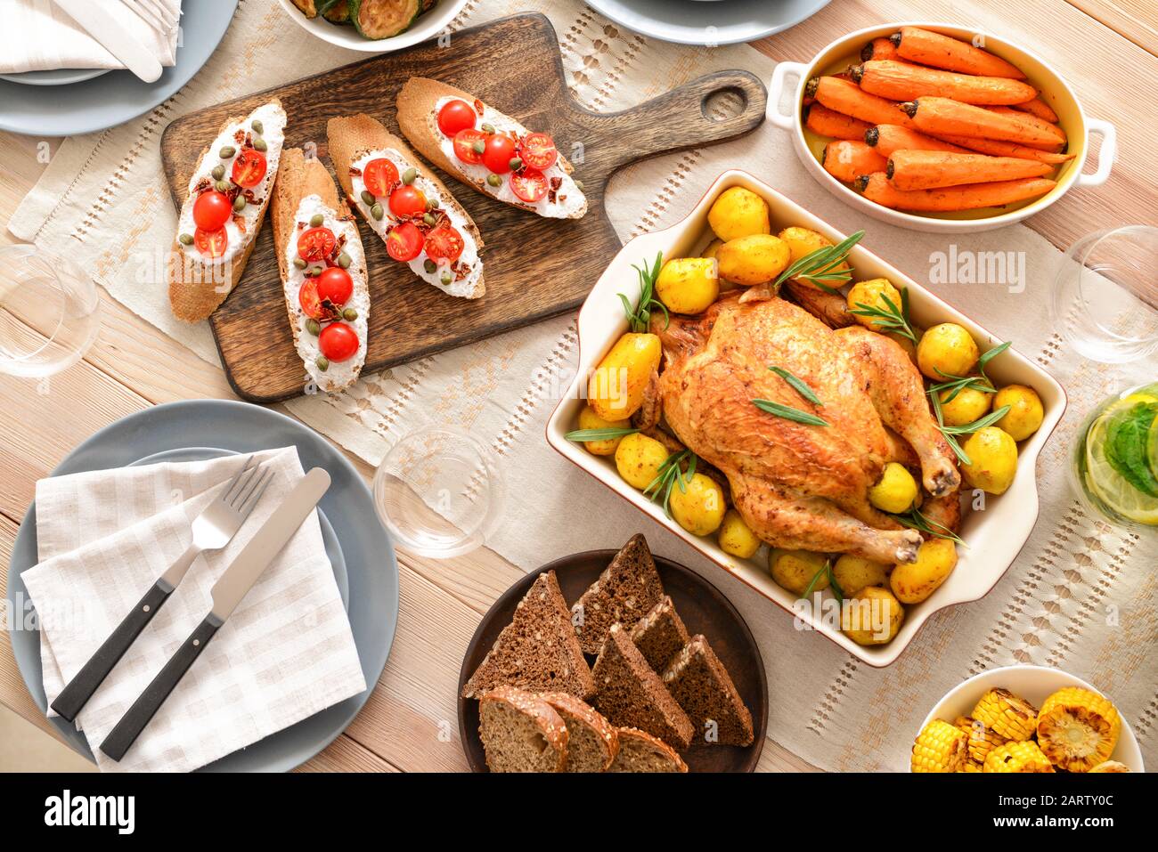 Table set for big family dinner Stock Photo - Alamy