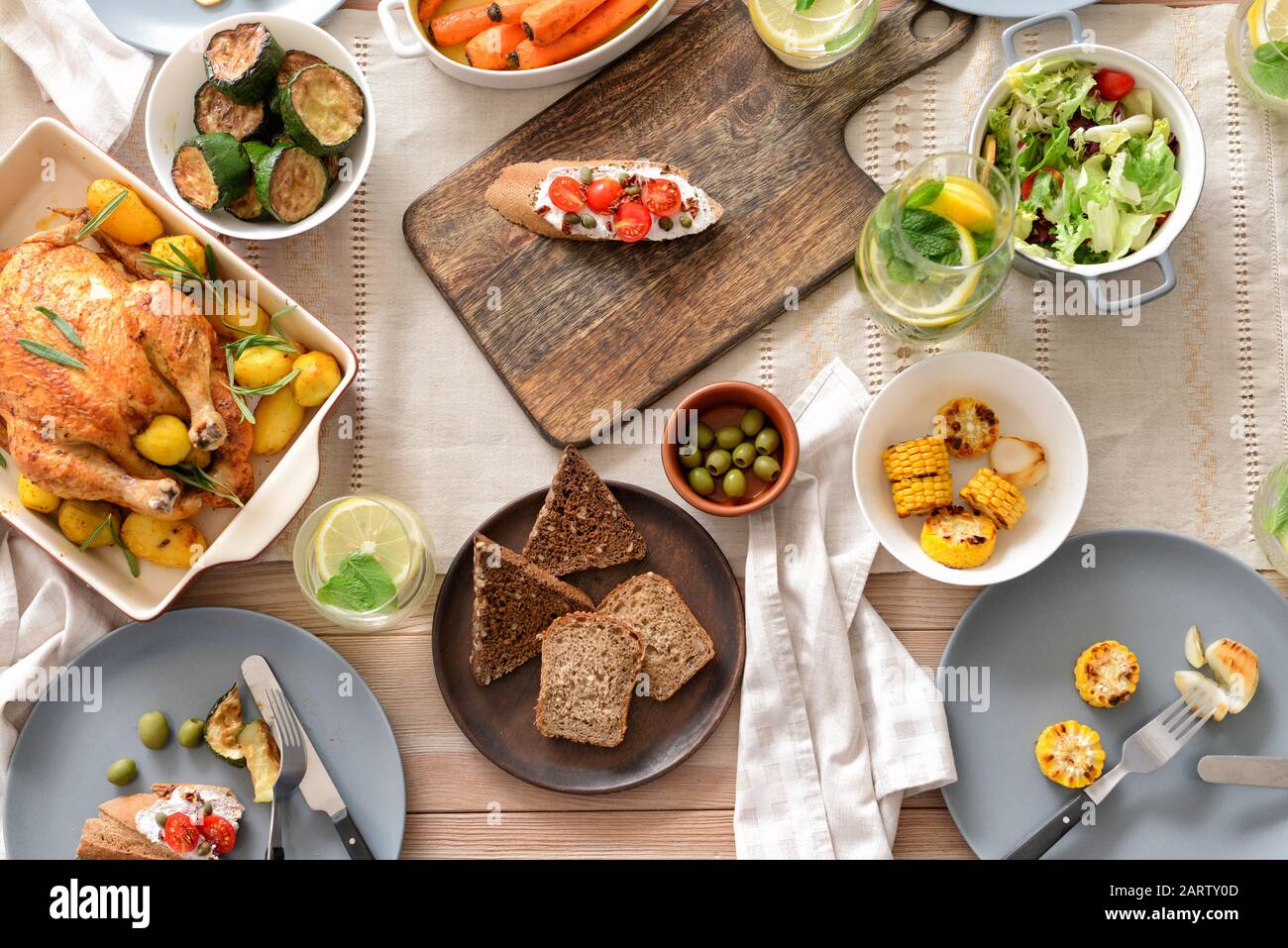 Table set for big family dinner Stock Photo - Alamy