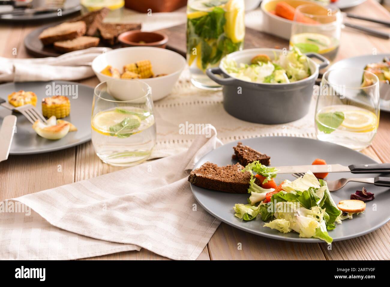 Table set for big family dinner Stock Photo - Alamy