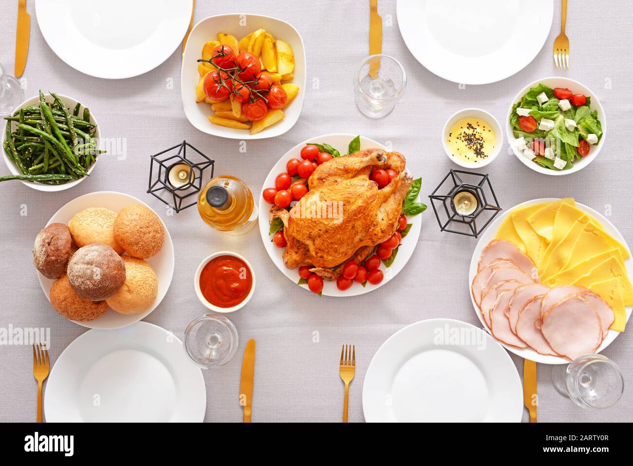 Table set for big family dinner Stock Photo - Alamy