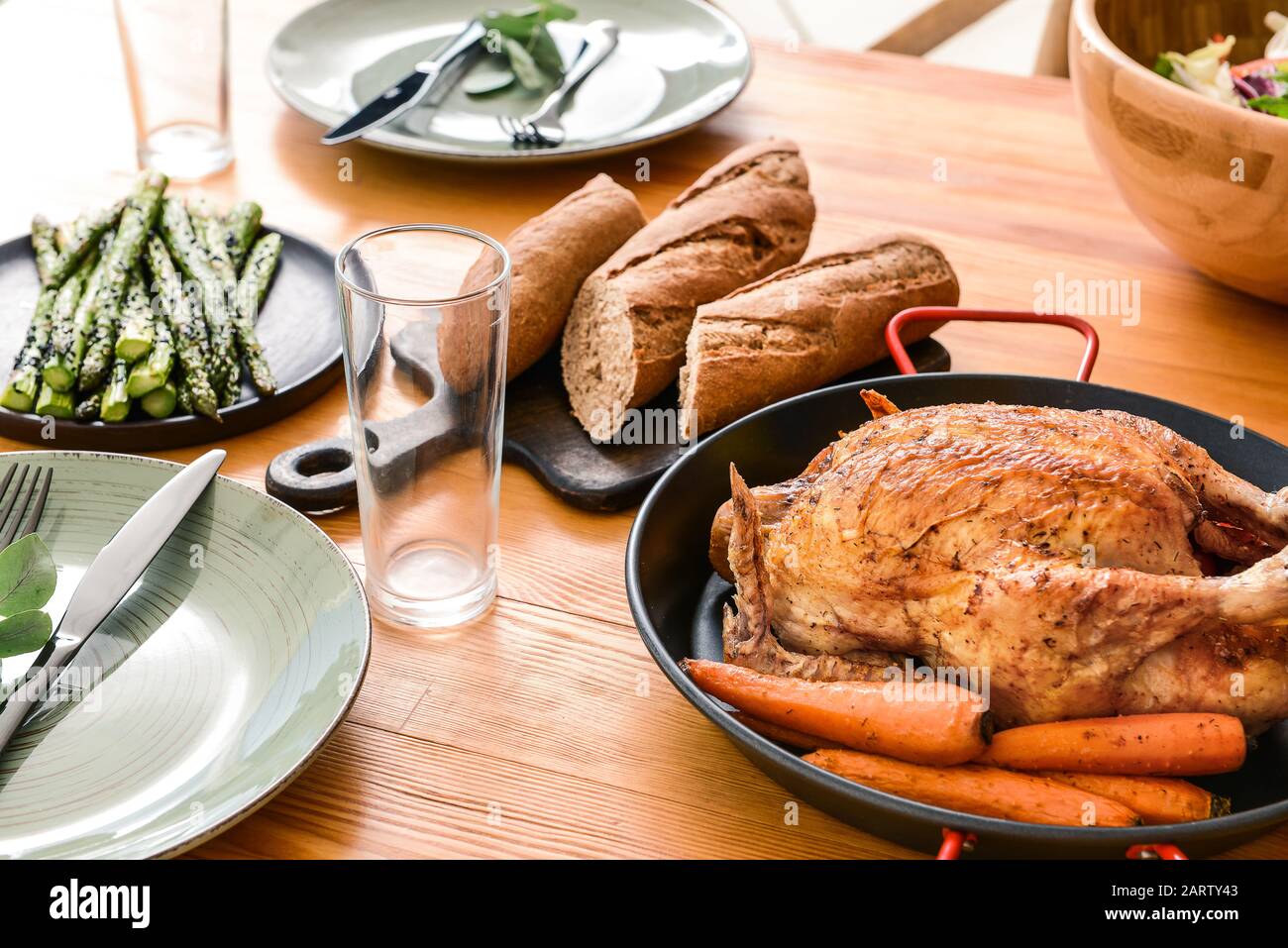 Table set for big family dinner Stock Photo - Alamy