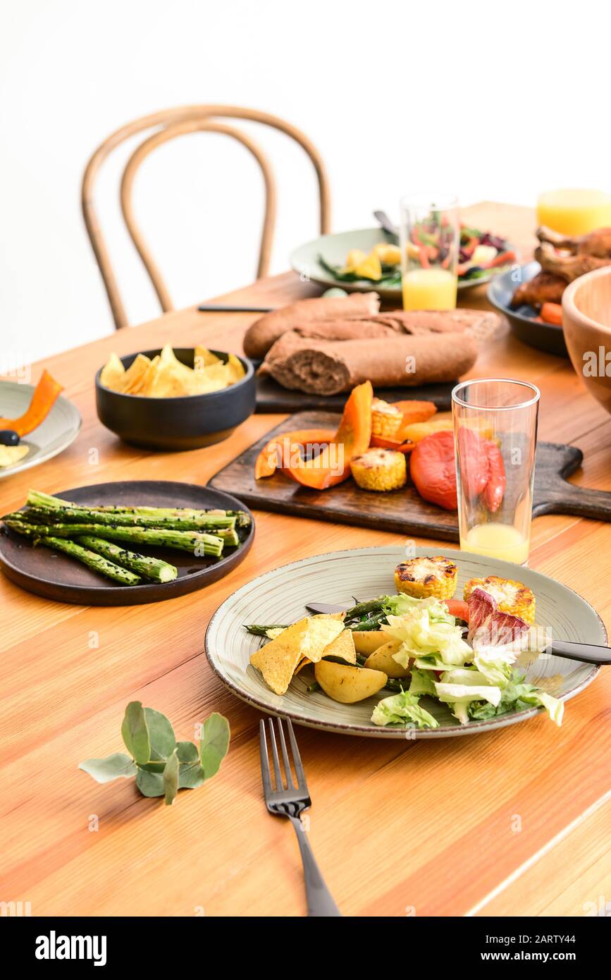 Table set for big family dinner Stock Photo - Alamy