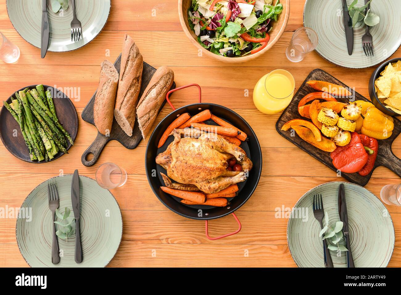 Table set for big family dinner Stock Photo - Alamy