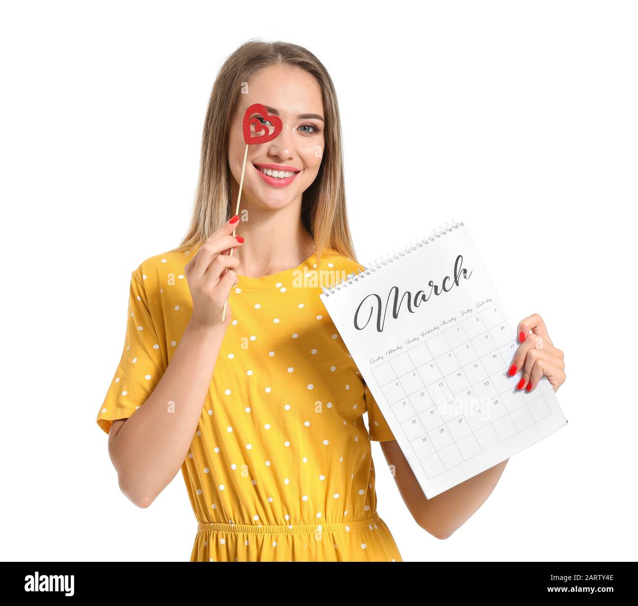 Beautiful young woman with calendar on white background. International ...