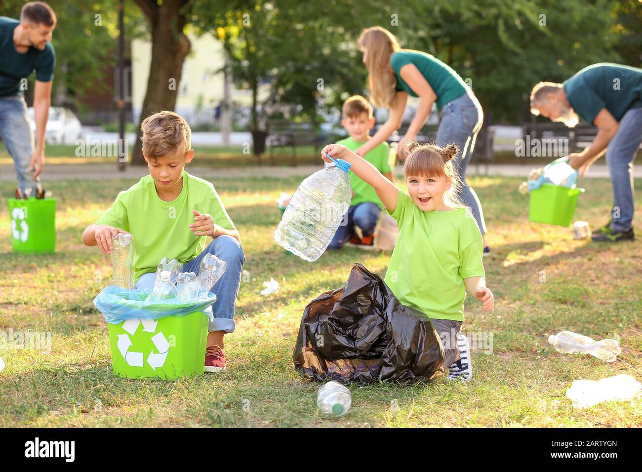 People gathering garbage outdoors. Concept of recycling Stock Photo - Alamy