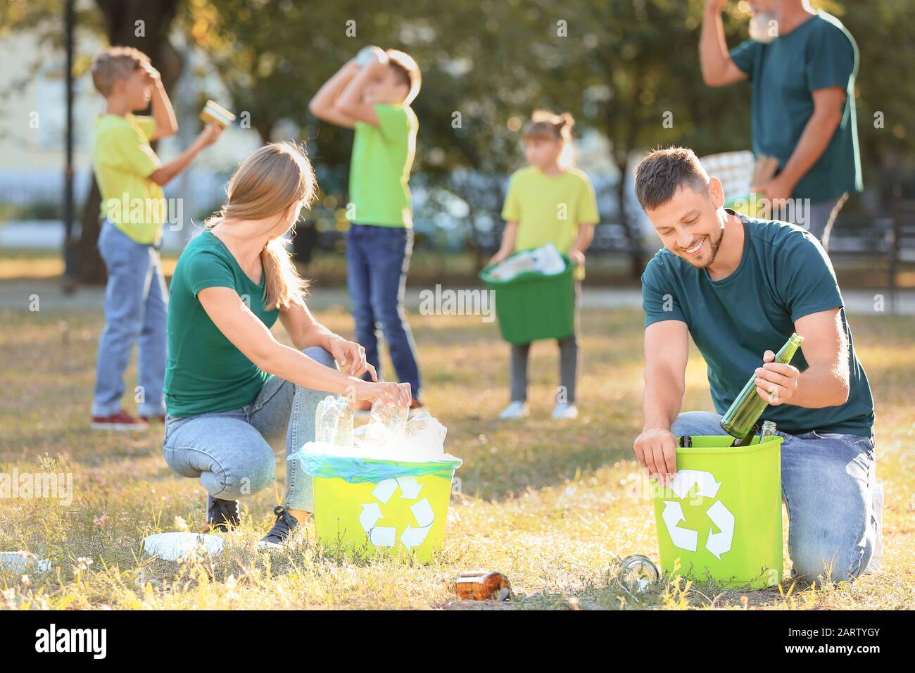 People gathering garbage outdoors. Concept of recycling Stock Photo - Alamy