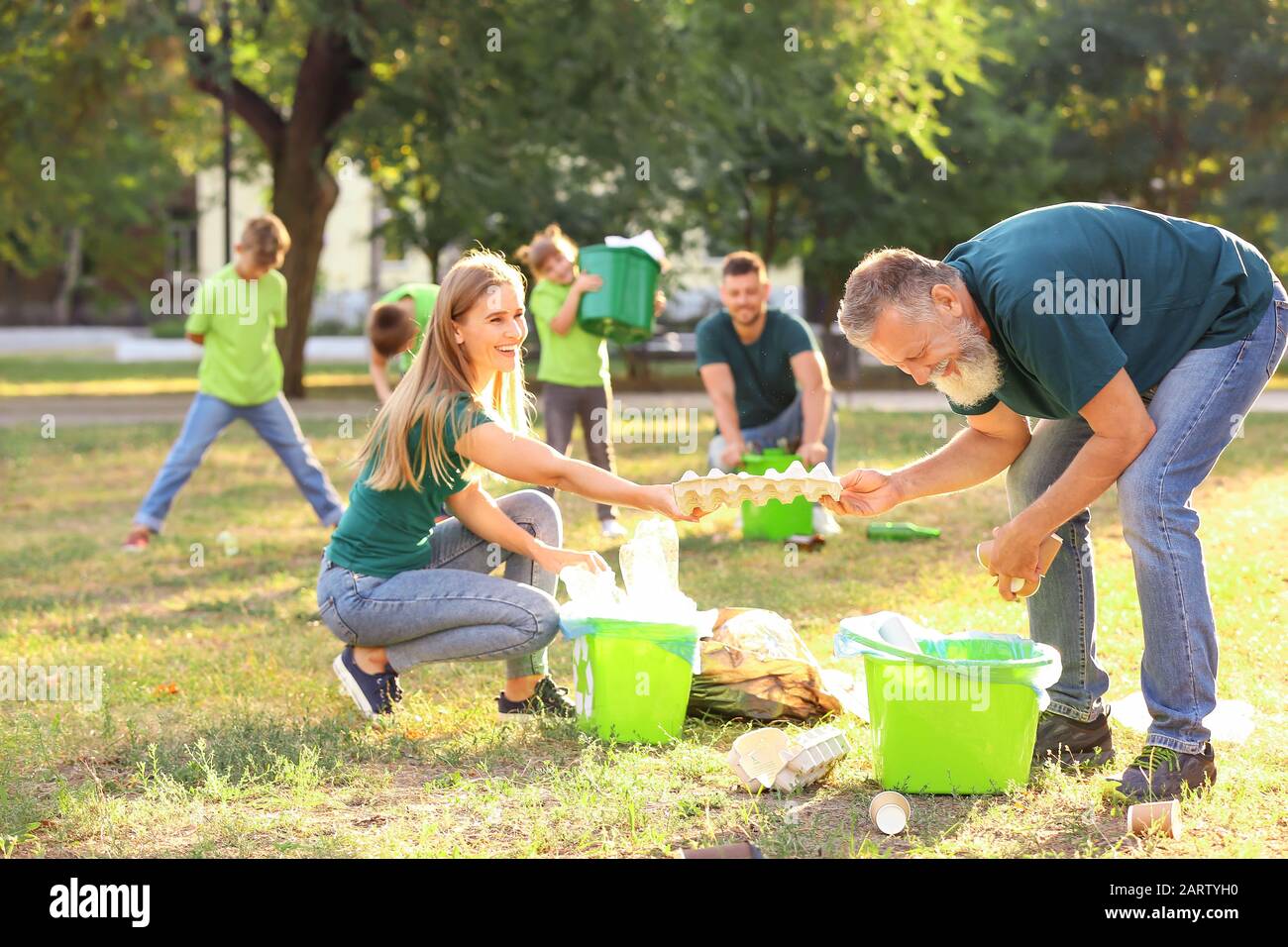 People gathering garbage outdoors. Concept of recycling Stock Photo - Alamy