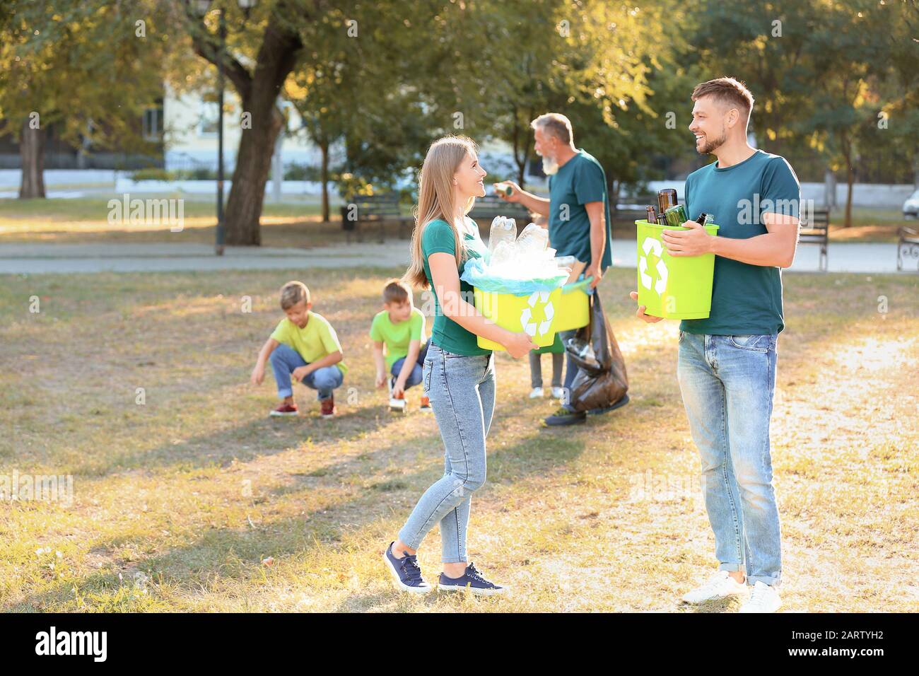 People gathering garbage outdoors. Concept of recycling Stock Photo - Alamy