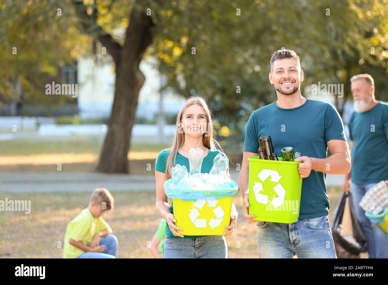 People gathering garbage outdoors. Concept of recycling Stock Photo - Alamy