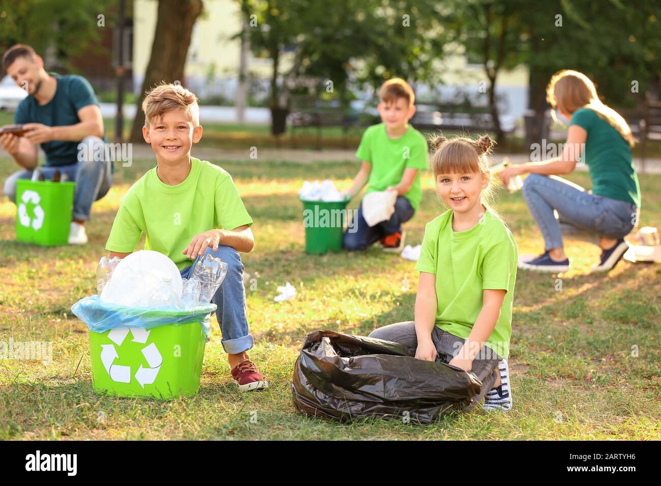 People gathering garbage outdoors. Concept of recycling Stock Photo - Alamy