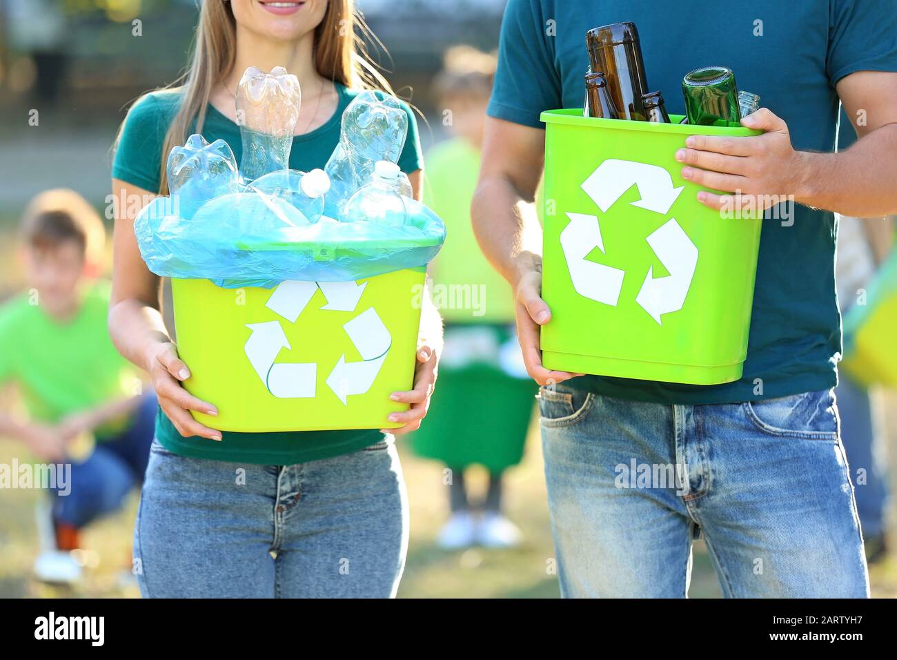 People holding containers with garbage outdoors. Concept of recycling ...