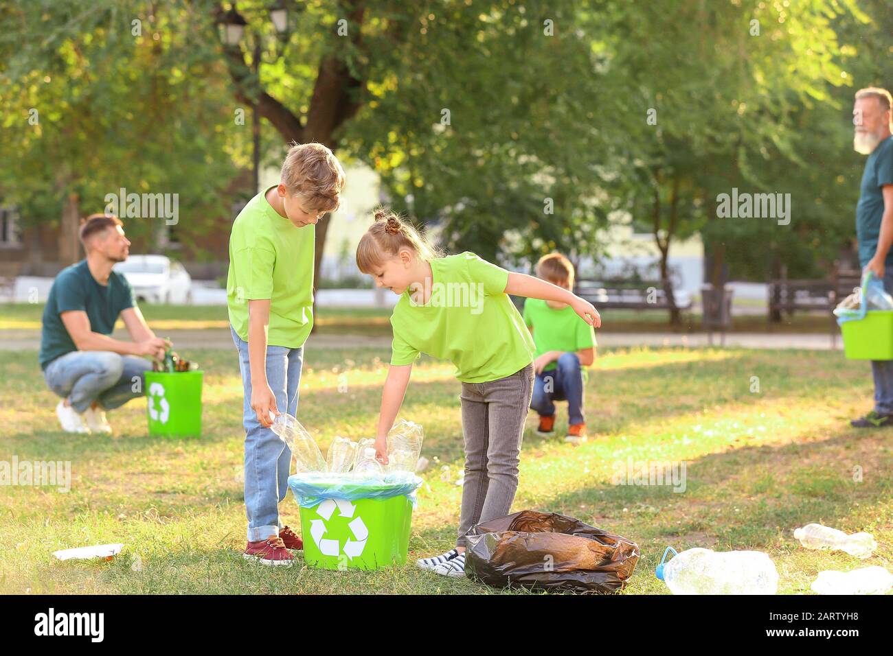 People gathering garbage outdoors. Concept of recycling Stock Photo - Alamy