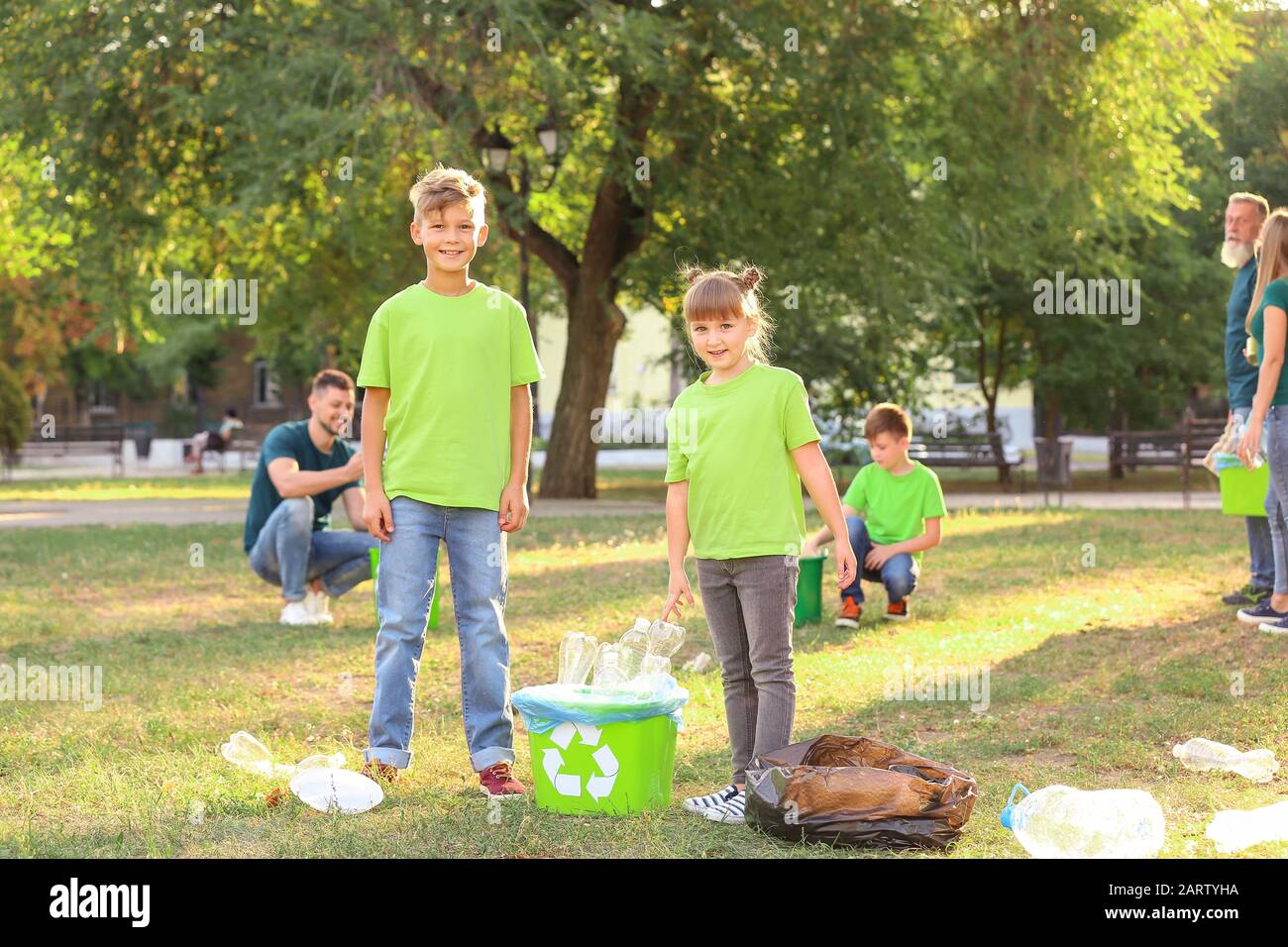 People gathering garbage outdoors. Concept of recycling Stock Photo - Alamy
