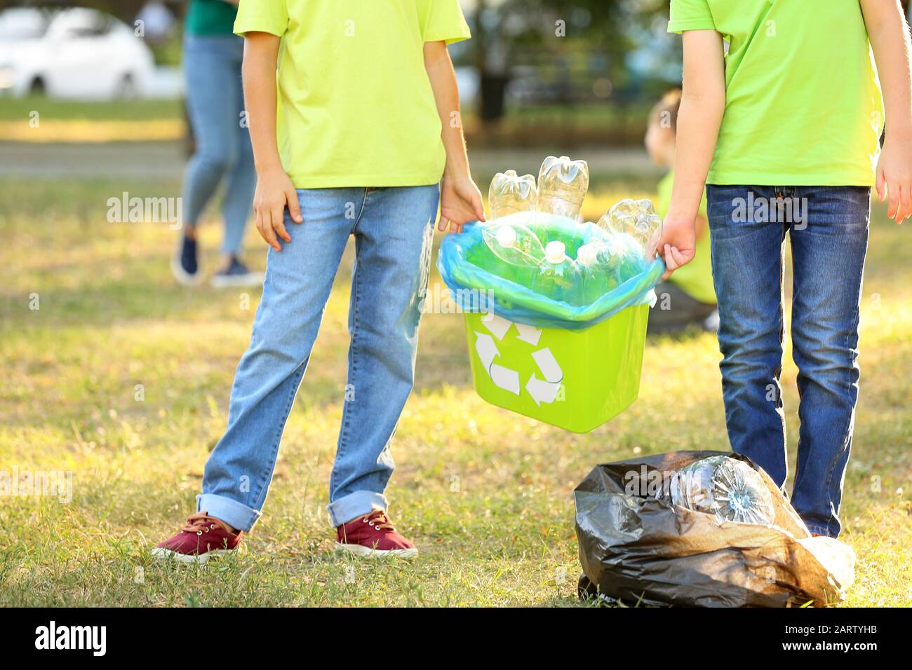People gathering garbage outdoors. Concept of recycling Stock Photo - Alamy