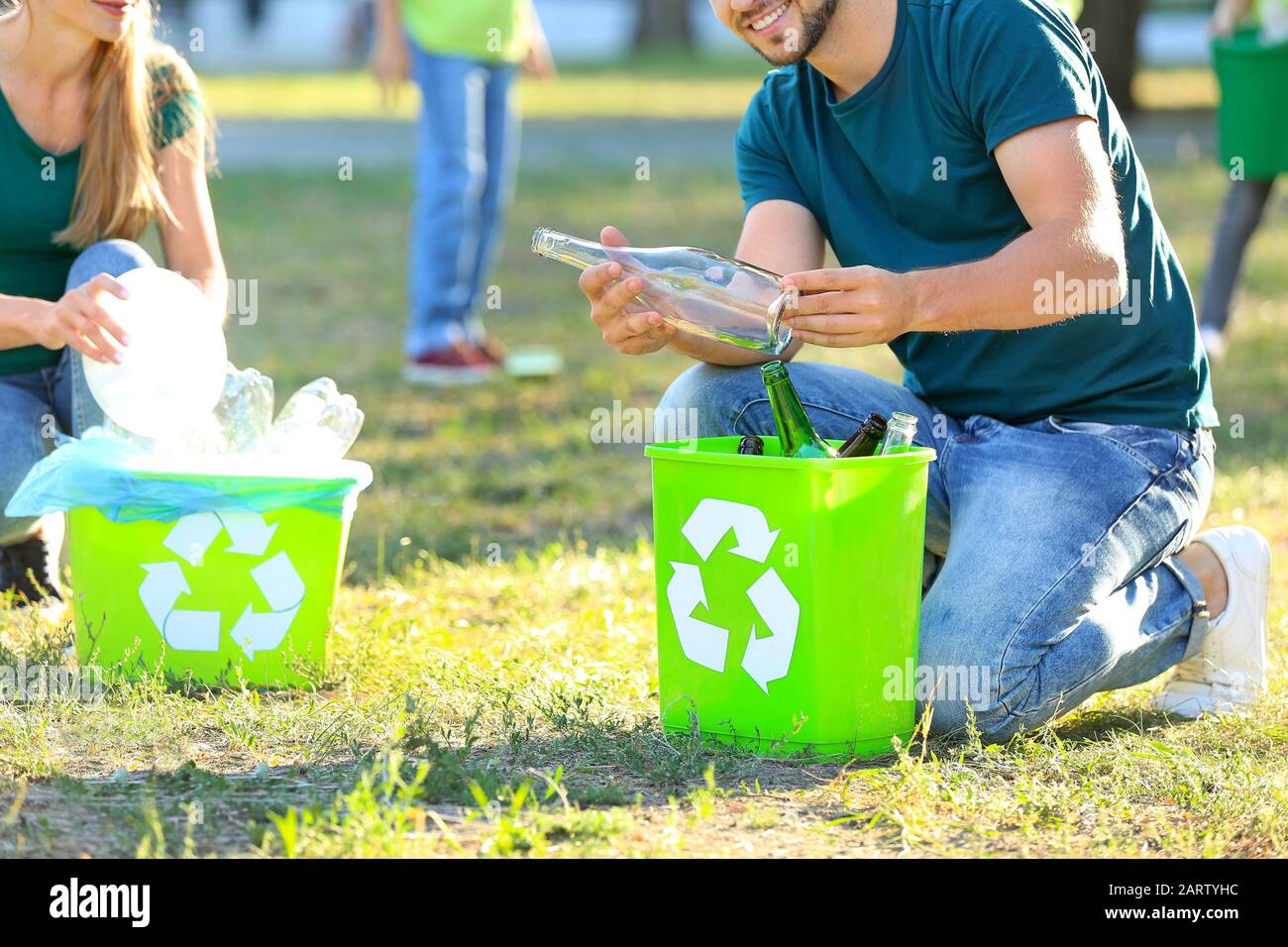 People gathering garbage outdoors. Concept of recycling Stock Photo - Alamy