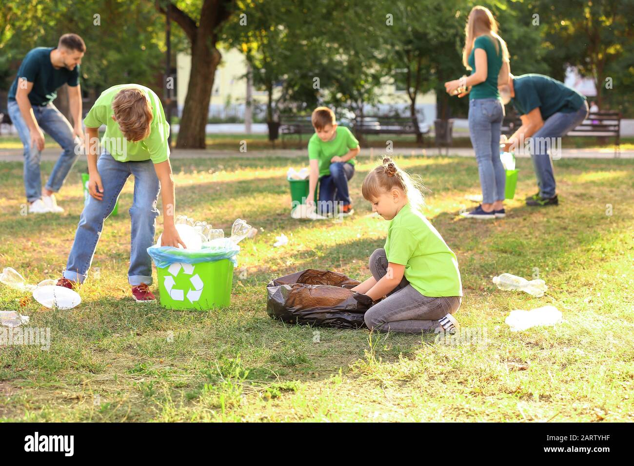 People gathering garbage outdoors. Concept of recycling Stock Photo - Alamy