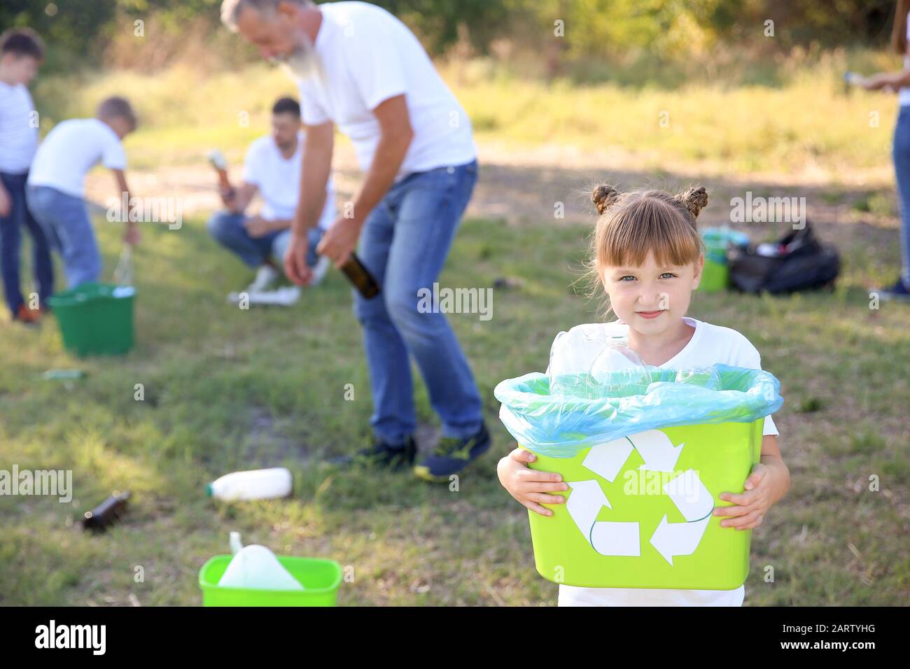 People gathering garbage outdoors. Concept of recycling Stock Photo - Alamy