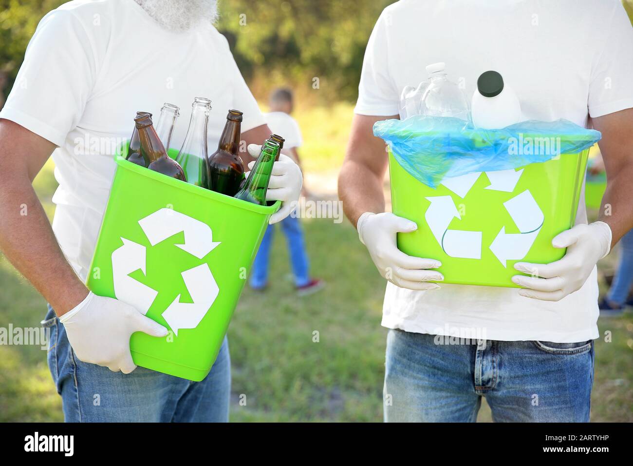 People with gathered garbage outdoors. Concept of recycling Stock Photo ...
