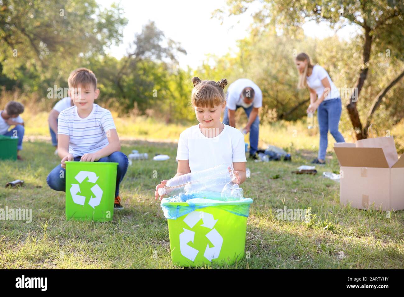 People gathering garbage outdoors. Concept of recycling Stock Photo - Alamy