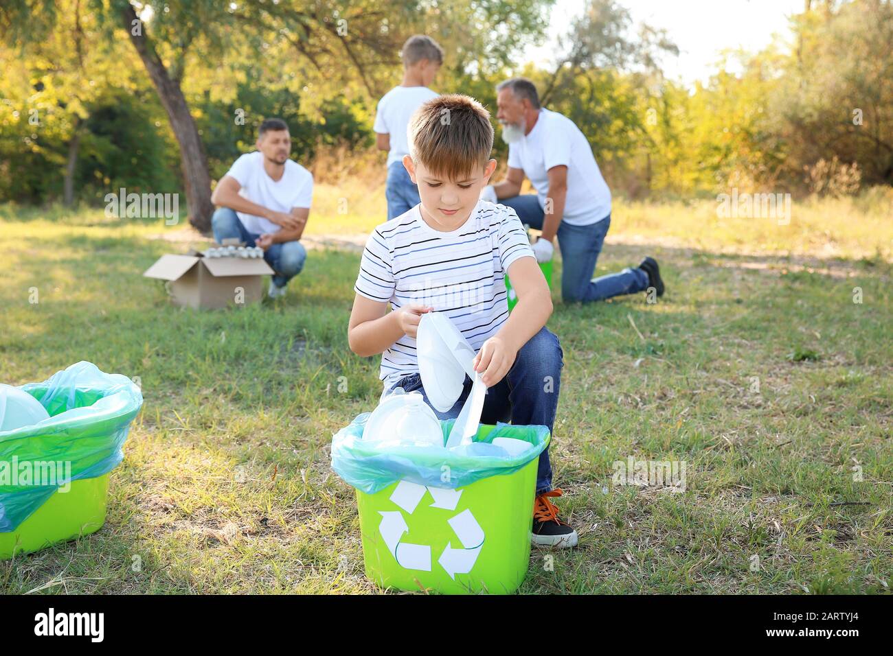 People gathering garbage outdoors. Concept of recycling Stock Photo - Alamy