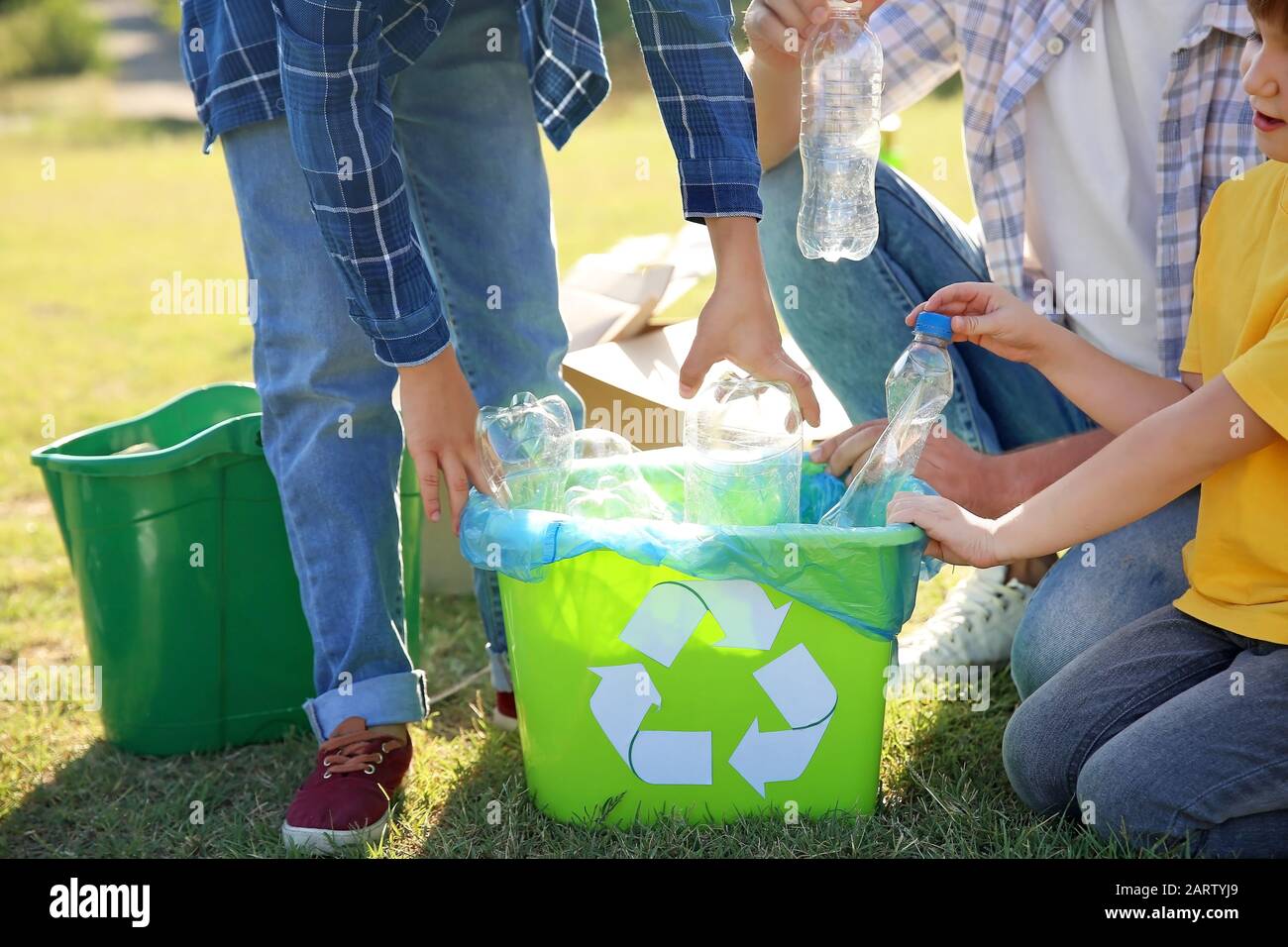 People gathering garbage outdoors. Concept of recycling Stock Photo - Alamy