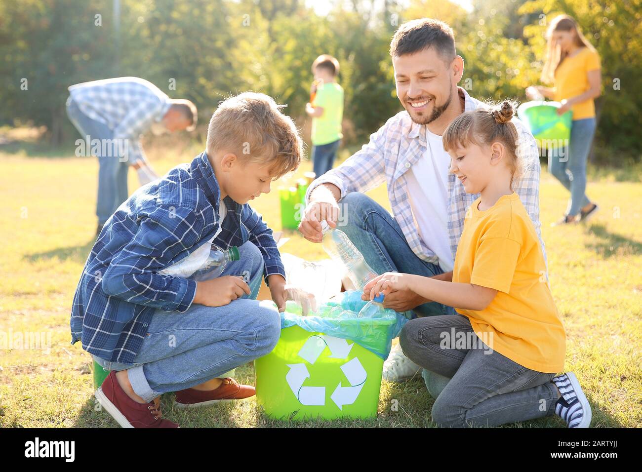 People gathering garbage outdoors. Concept of recycling Stock Photo - Alamy