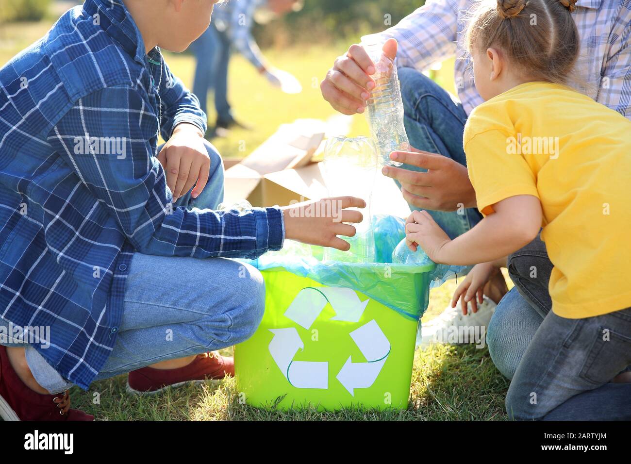 People gathering garbage outdoors. Concept of recycling Stock Photo - Alamy