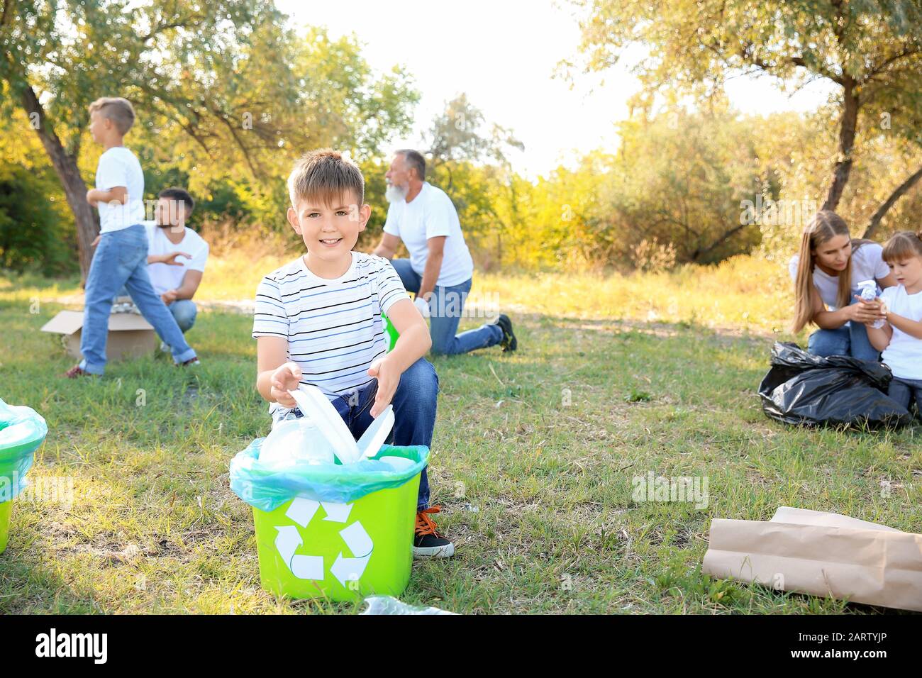 People gathering garbage outdoors. Concept of recycling Stock Photo - Alamy