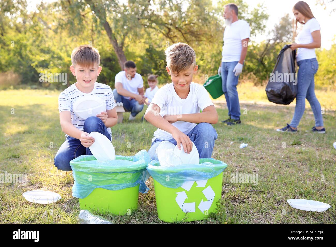 People gathering garbage outdoors. Concept of recycling Stock Photo - Alamy