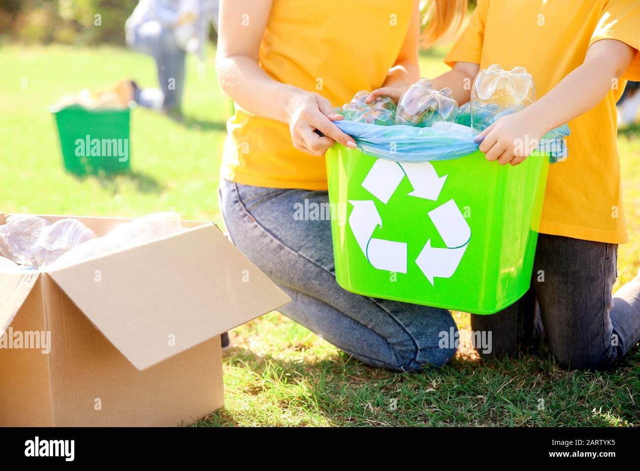 People gathering garbage outdoors. Concept of recycling Stock Photo - Alamy