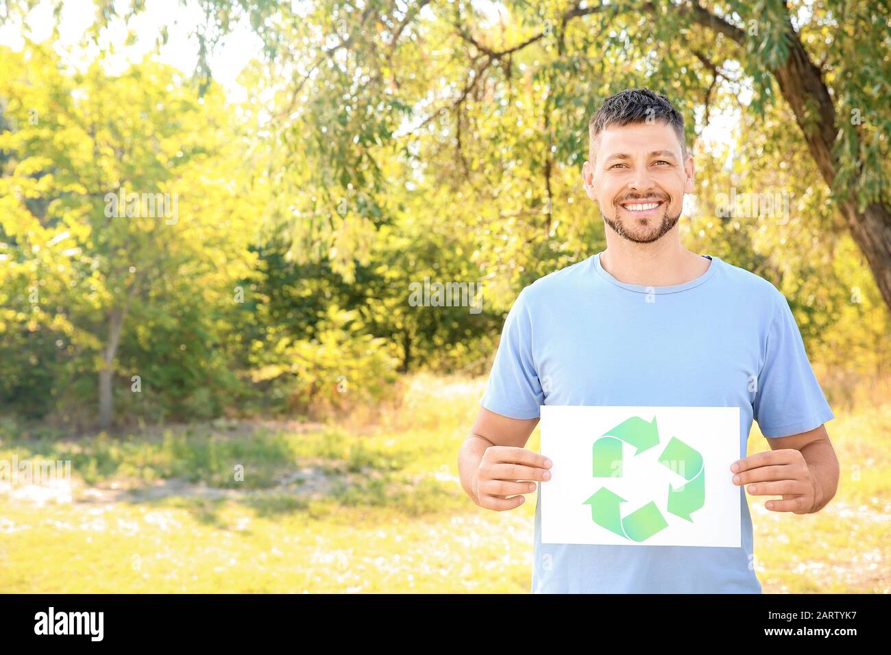 Man holding recycling sign hi-res stock photography and images - Alamy