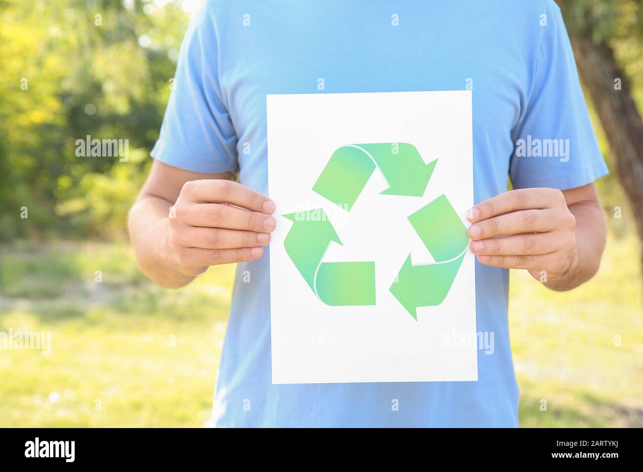 Man holding recycling sign hi-res stock photography and images - Alamy