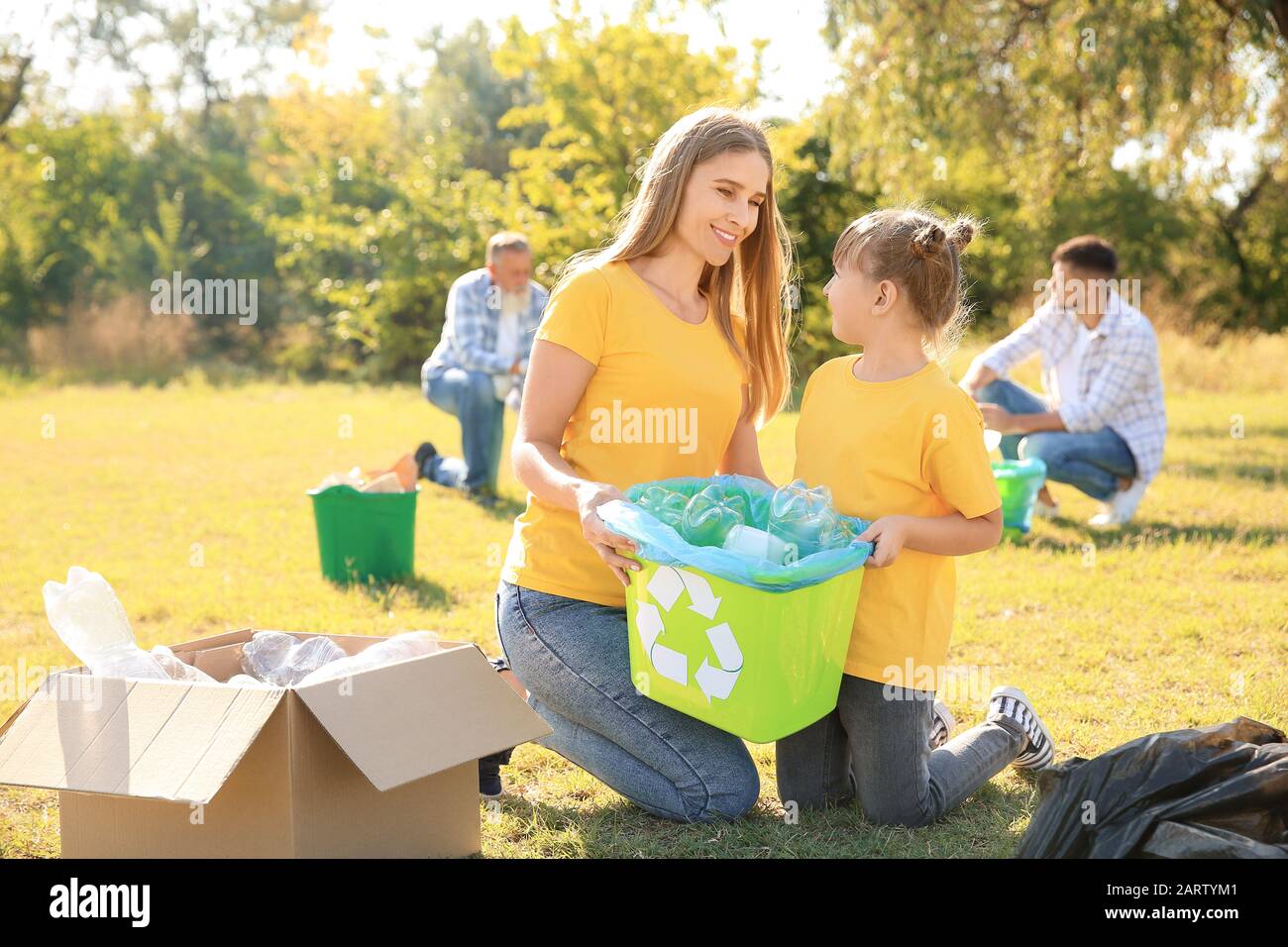People gathering garbage outdoors. Concept of recycling Stock Photo - Alamy