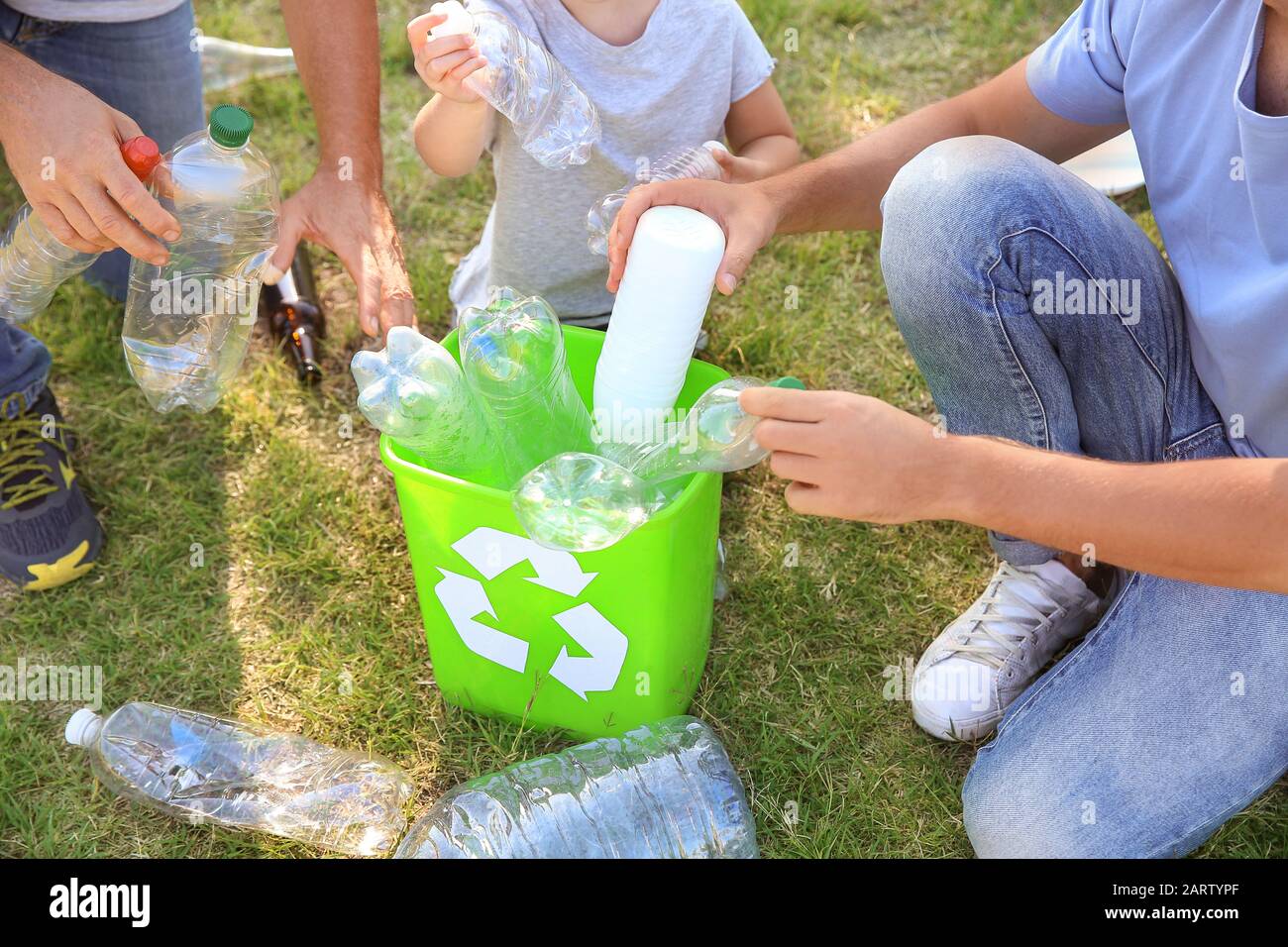 People gathering garbage outdoors. Concept of recycling Stock Photo - Alamy