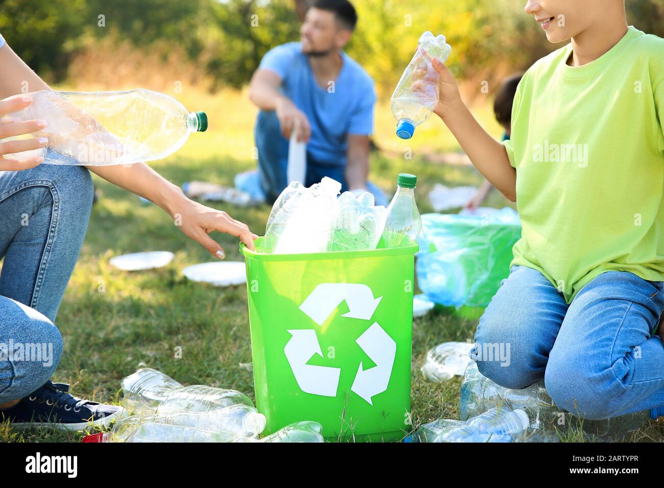 People gathering garbage outdoors. Concept of recycling Stock Photo - Alamy