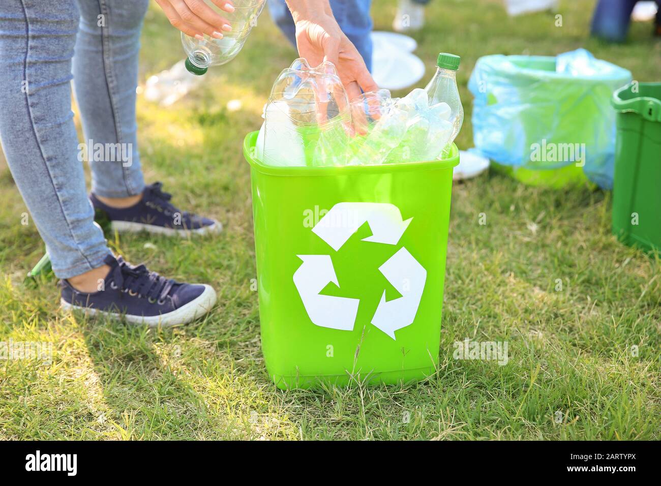People gathering garbage outdoors. Concept of recycling Stock Photo - Alamy