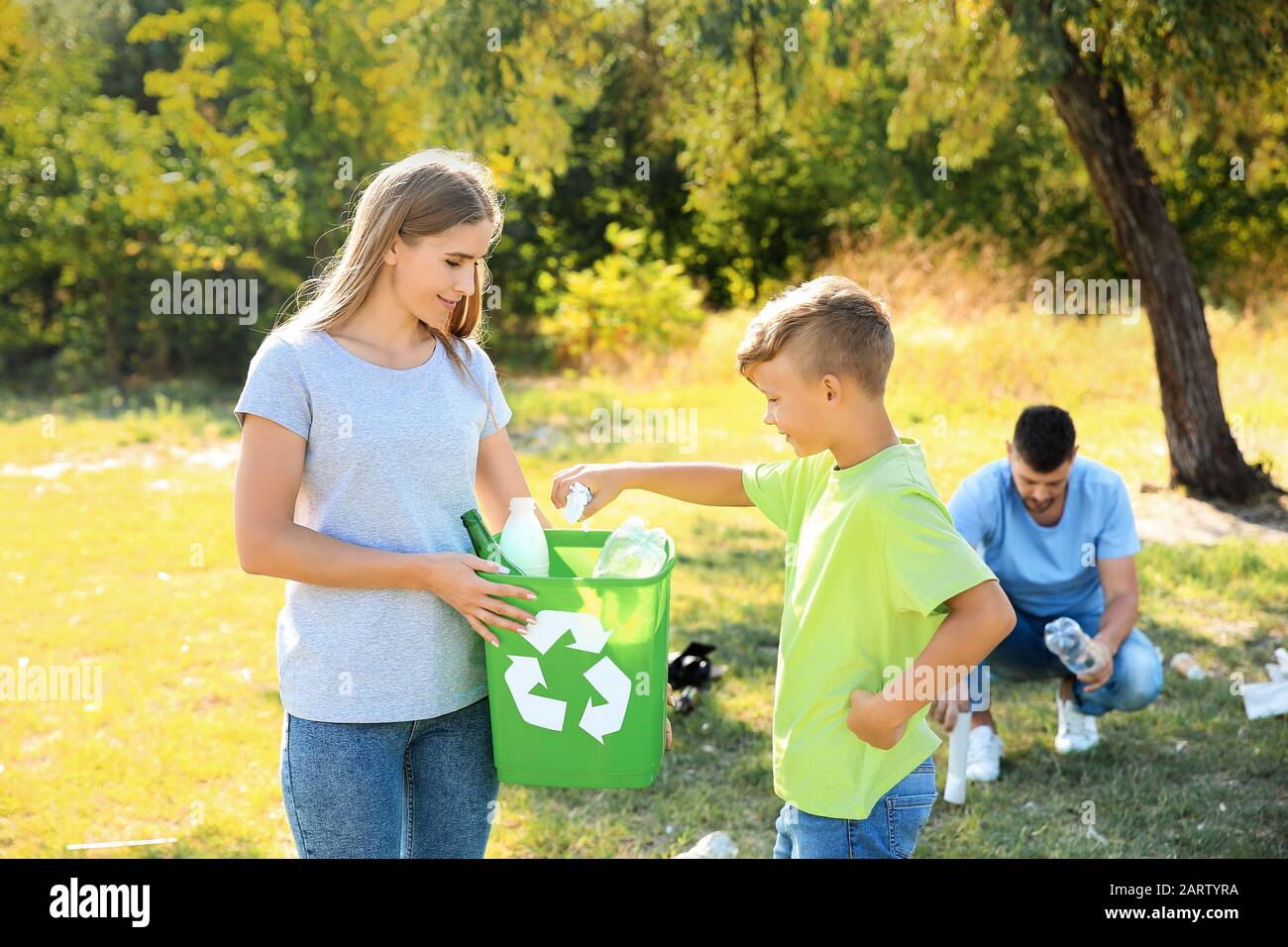 People gathering garbage outdoors. Concept of recycling Stock Photo - Alamy