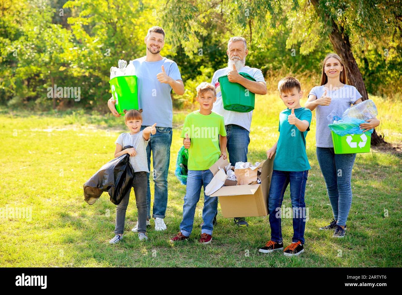People with gathered garbage outdoors. Concept of recycling Stock Photo ...