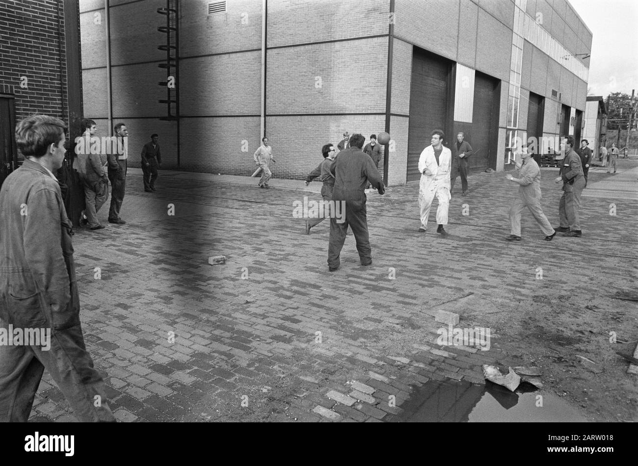 Strike at Werkspoor Utrecht continues. Workers playing football outside ...