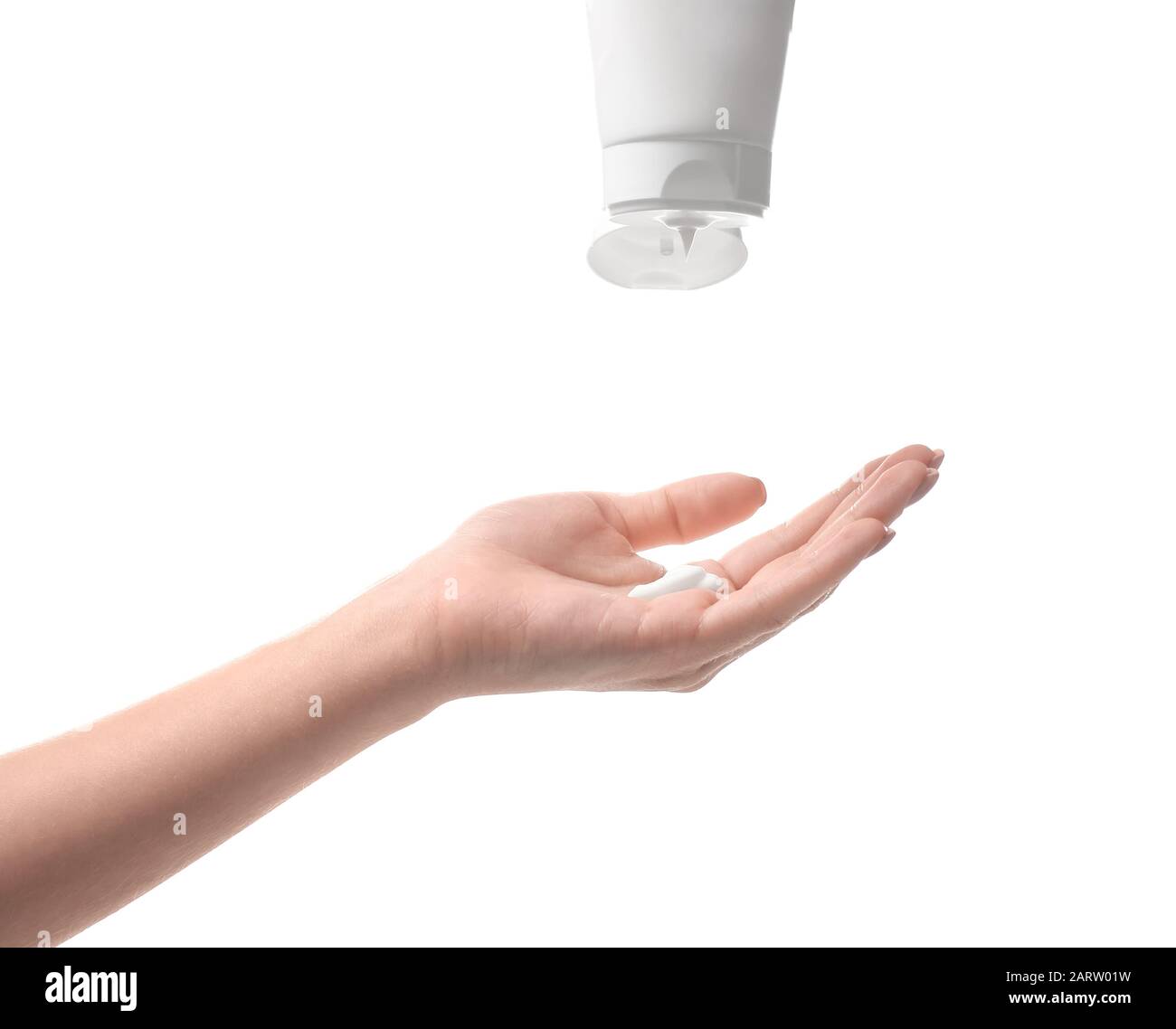 Applying of cream onto hand against white background Stock Photo - Alamy